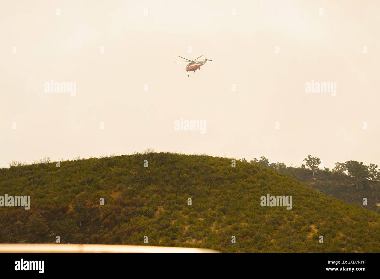 United States. 19th June, 2024. A helicopter is seen over the mountains ...
