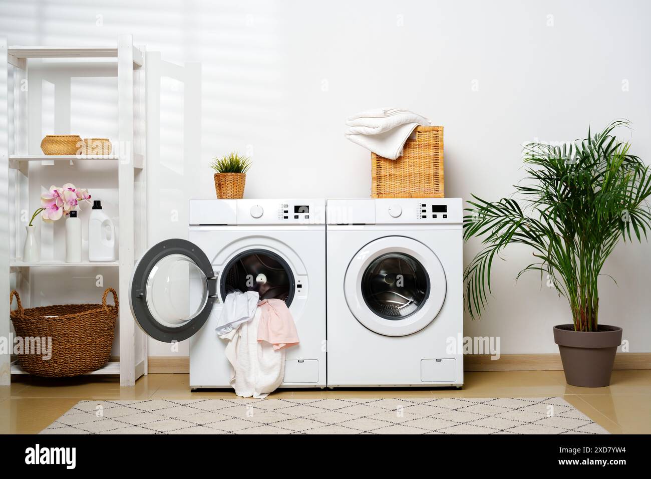 Modern Laundry Room With White Washing Machines and Open Door Stock ...