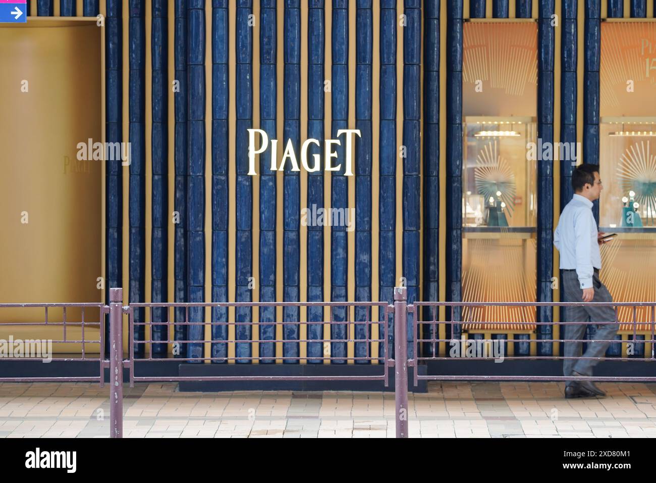 Hong Kong, China. 19th June, 2024. Pedestrian walks past the Swiss ...