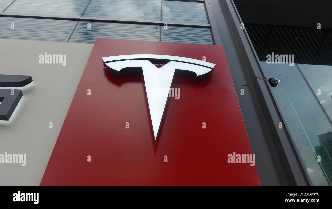 A Tesla logo is displayed at a Tesla branch in Hong Kong. (Photo by ...