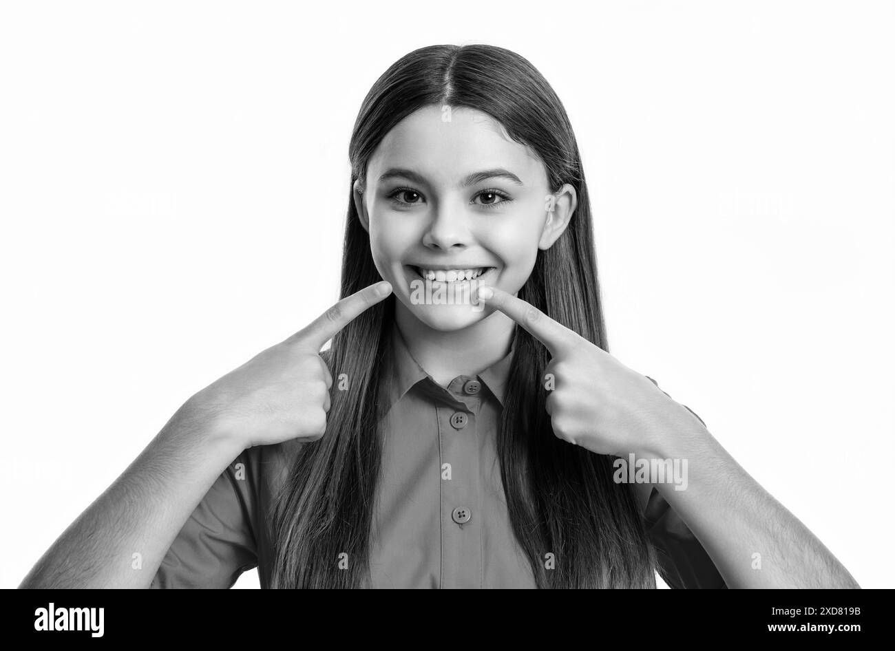teen girl point finger on smile. teen girl showing smile in studio ...