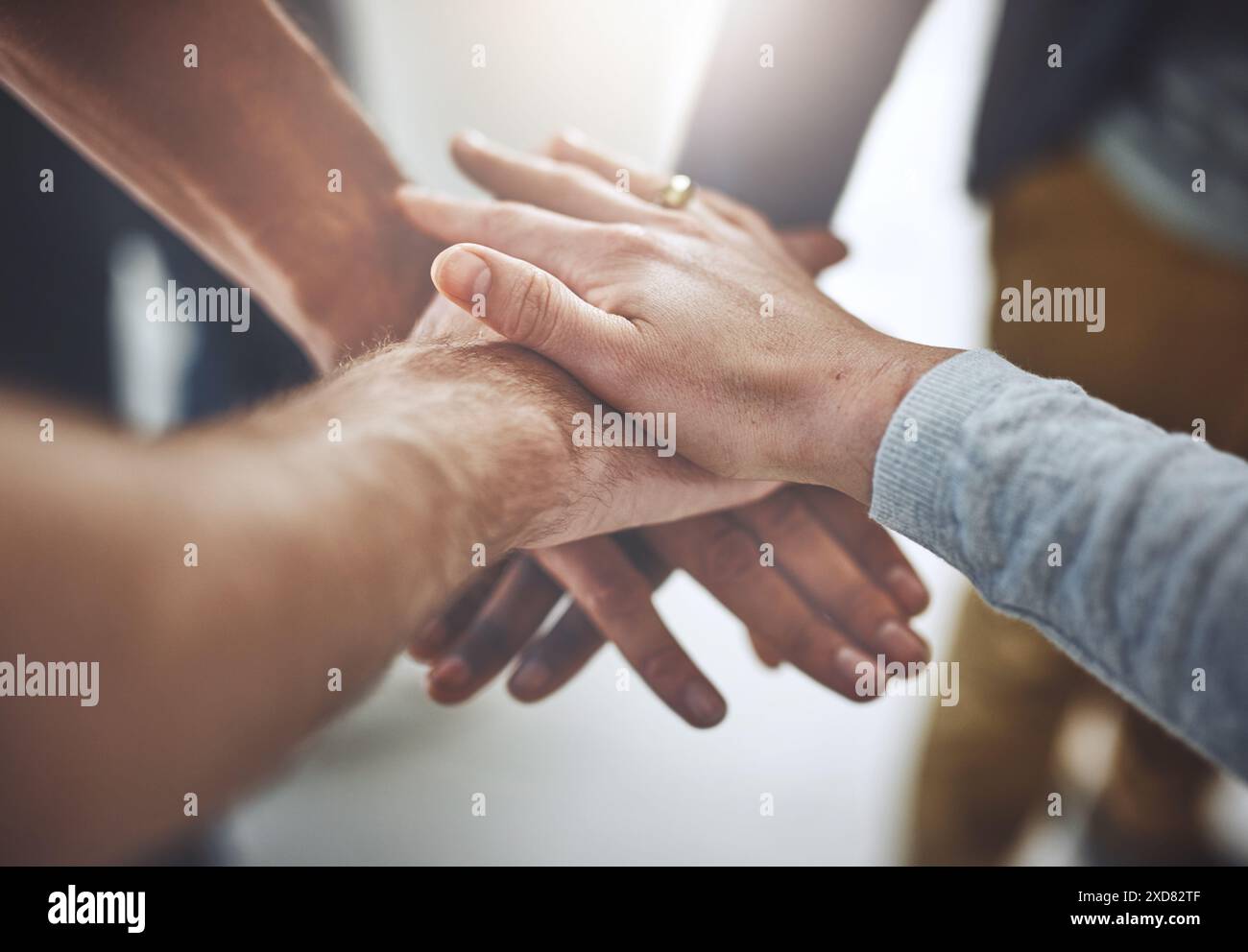 People, hands and huddle together for partnership, problem solving and ...