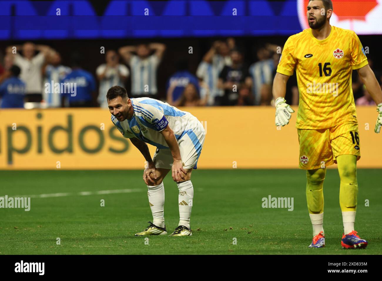 Argentina's forward Lionel Messi (L) gestures next Canada’s goalkeeper ...