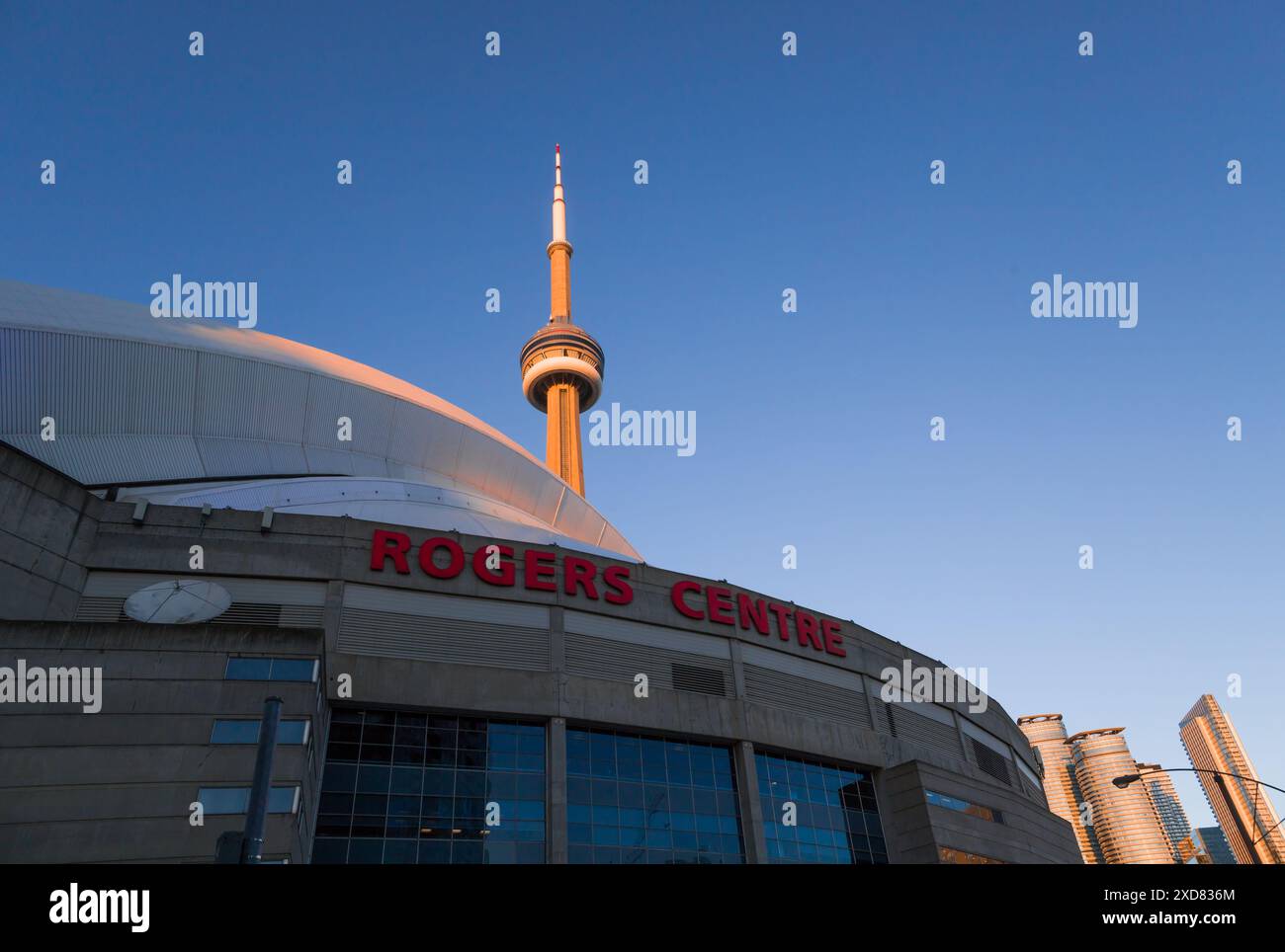 Rogers centre and CN tower at sunset time. Baseball stadium and new ...