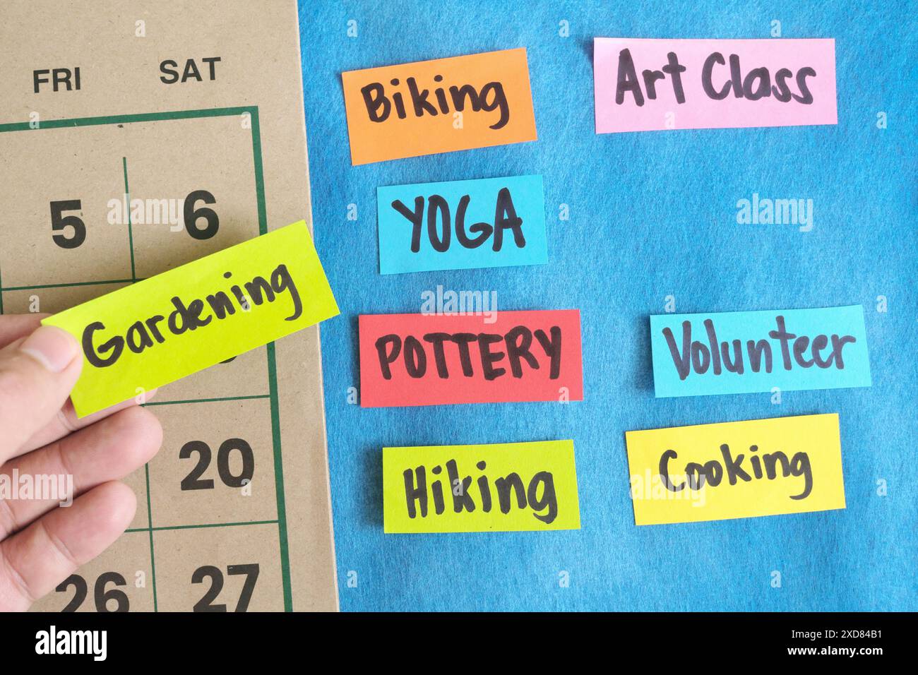 Organizing weekend wellness activity on a calendar. Paper notes on a ...
