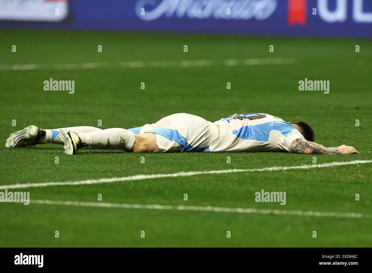 Argentina s forward Lionel Messi lies fallen on the field during the ...