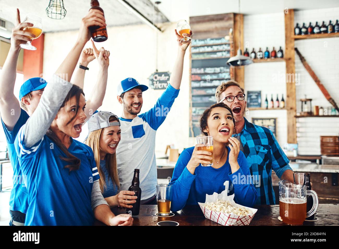 Friends, celebration and watching tv at sport pub with game, goal and ...