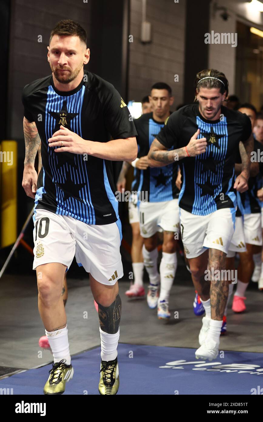Argentina’s Lionel Messi (L) and teammates make excersices during the ...