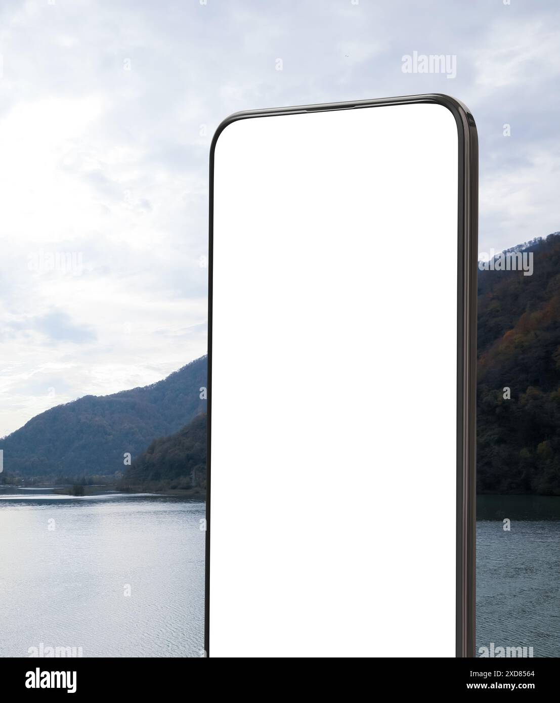 Mobile phone with empty screen against beautiful landscape. Space for ...