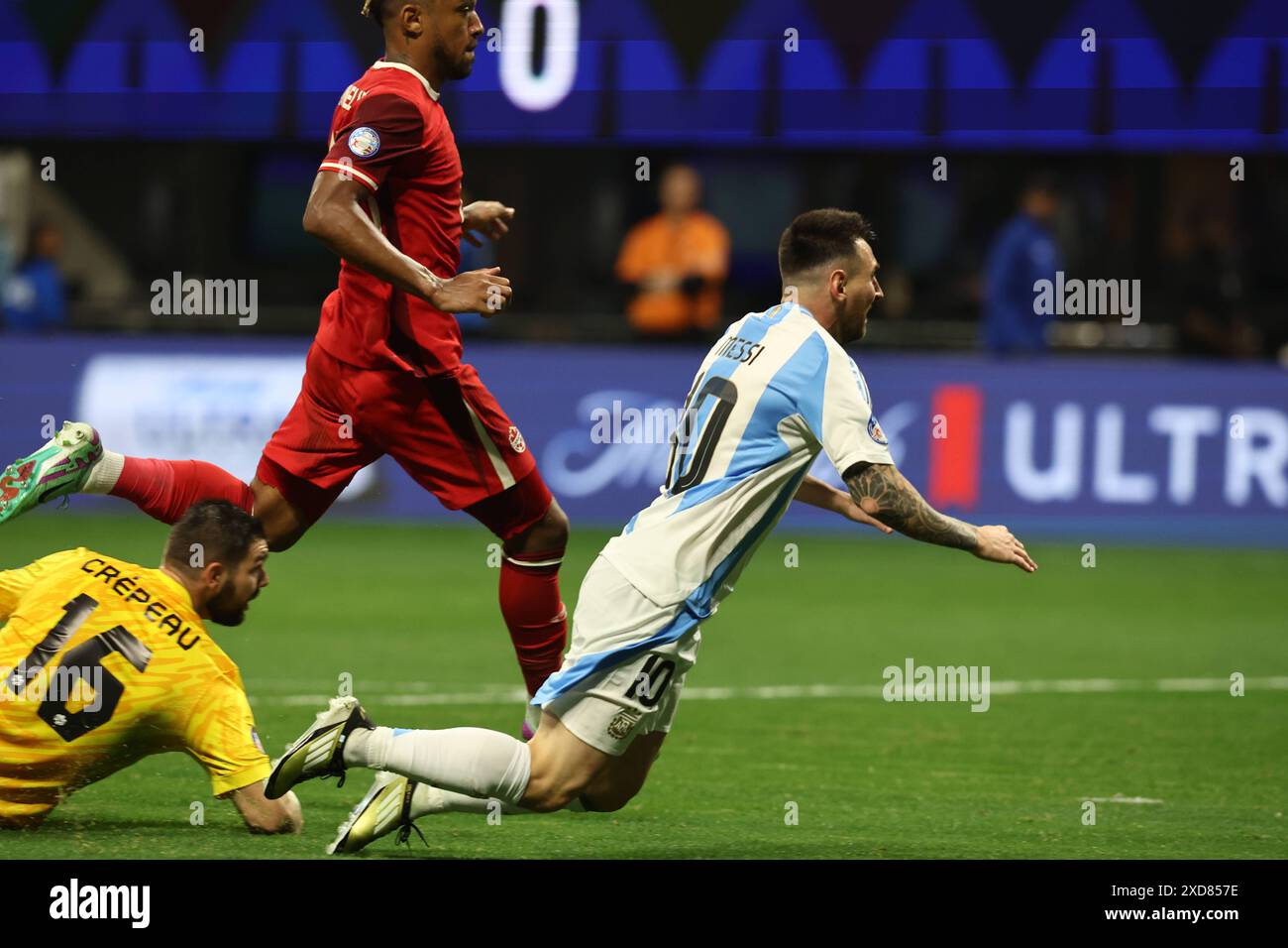 Argentina s forward Lionel Messi R is fouled by Canadas goalkeeper Maxime Crepeau L during the ...