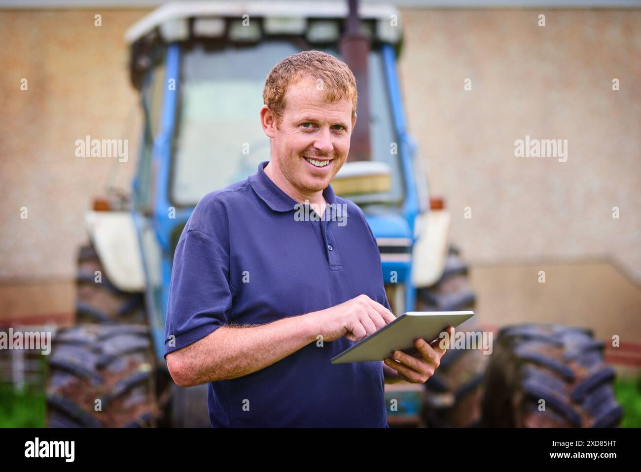 Farming, portrait and man with tablet by tractor for production ...