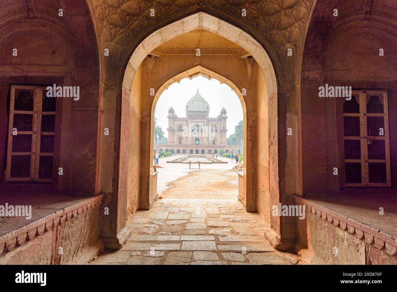 View of Safdarjung's Tomb through arched gate. Beautiful red sandstone ...