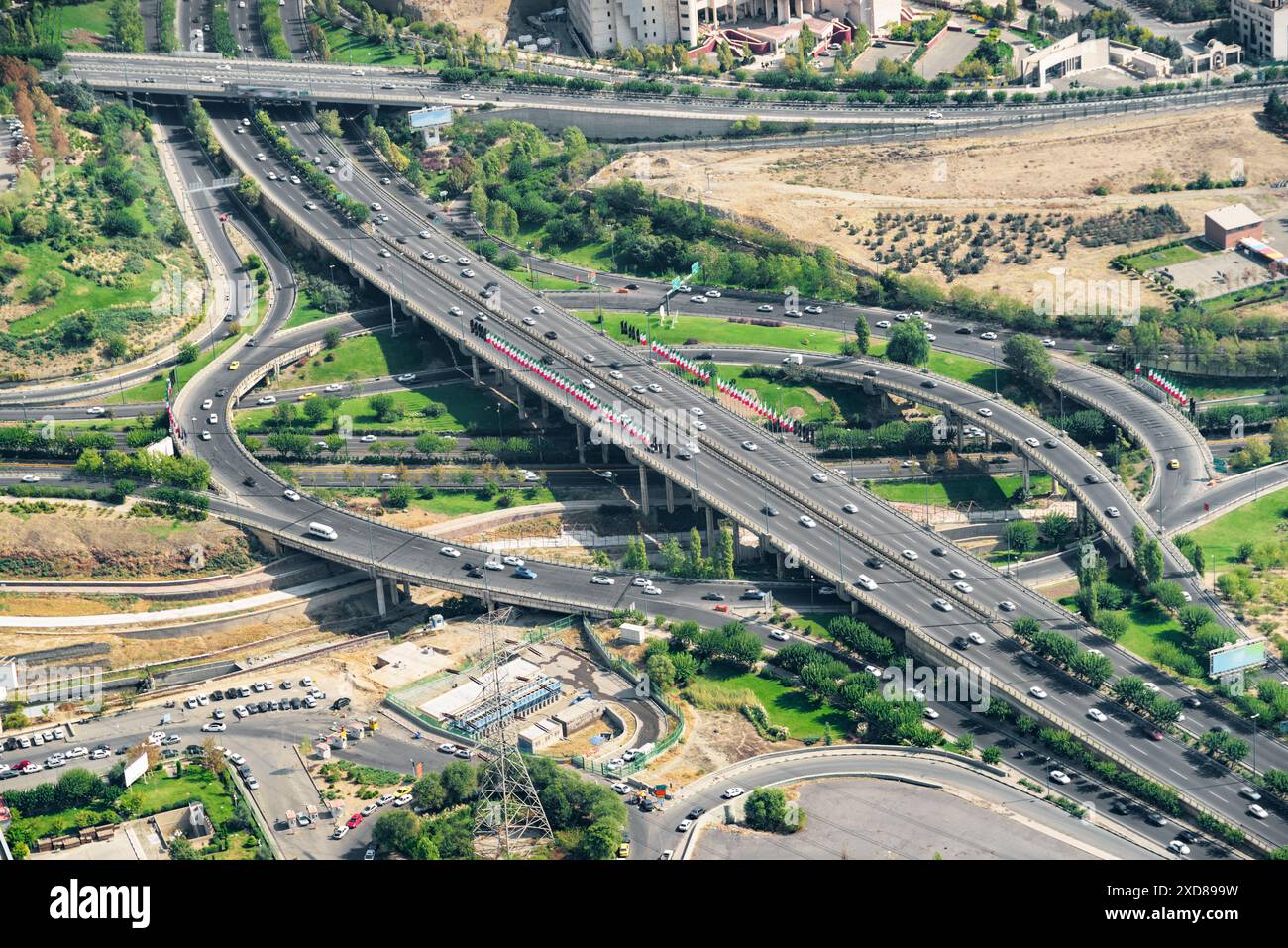 Aerial view of two-level road junction in Tehran, Iran. Day traffic of ...