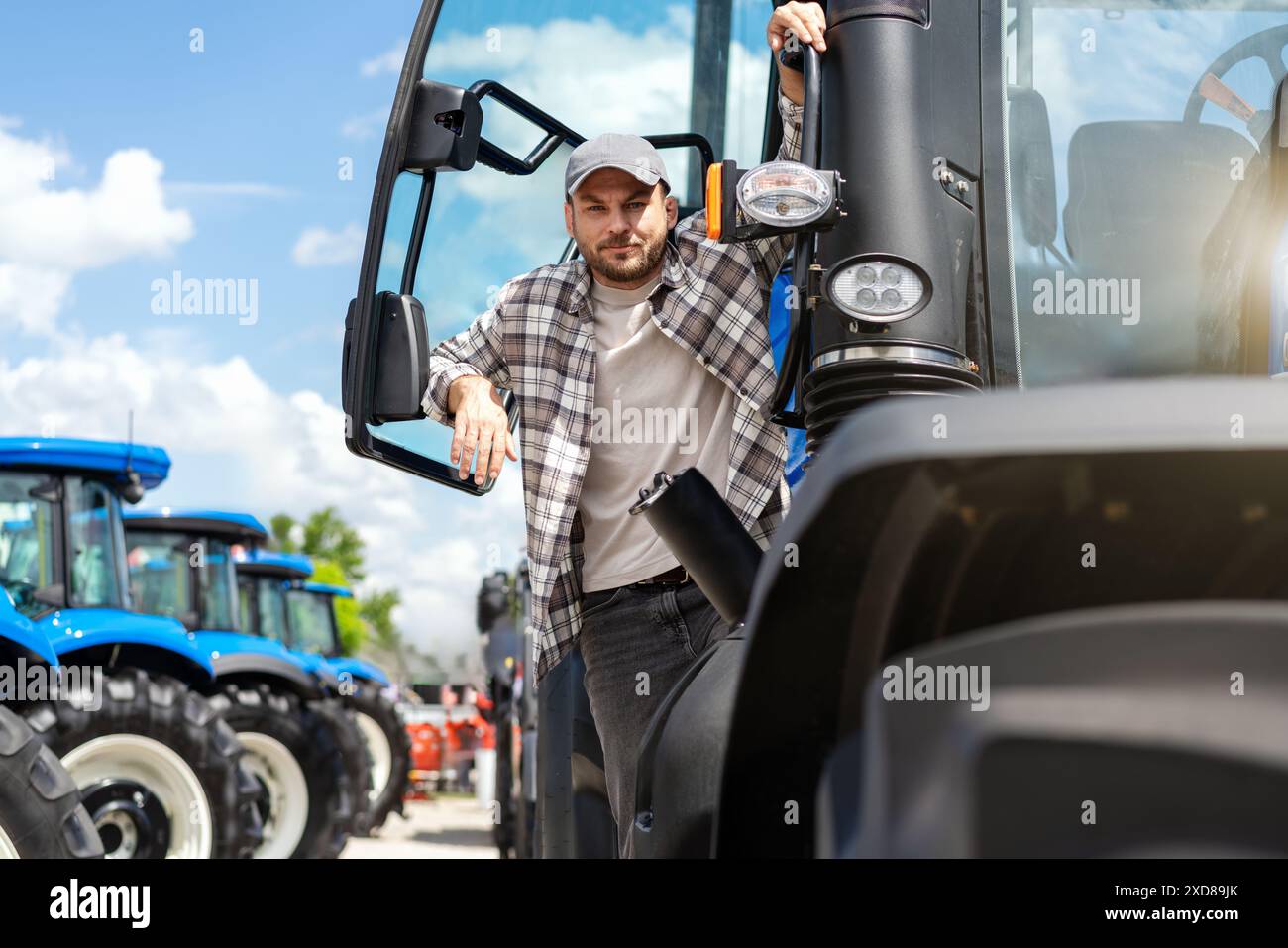Farmer posing with tractor hi-res stock photography and images - Alamy
