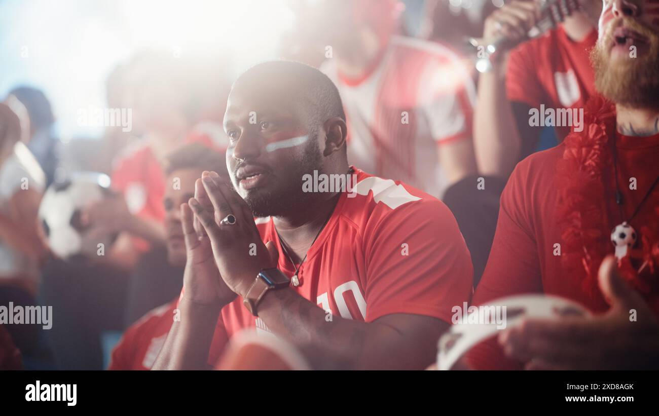 Sport Stadium Soccer Match: Diverse Crowd of Fans Cheer for their Red ...