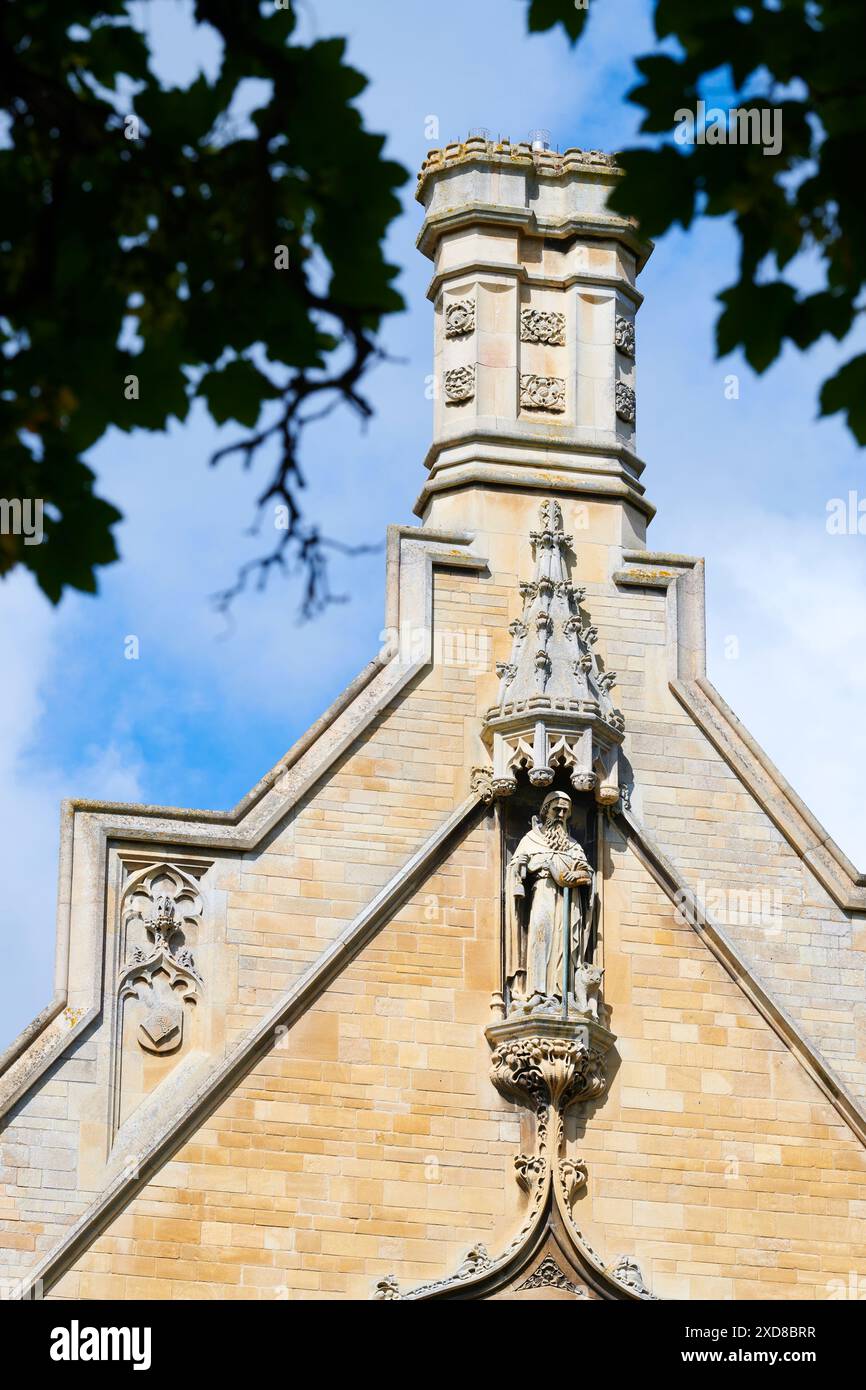 Statue of founder, William Laxton, under the chimney on The Great Hall ...