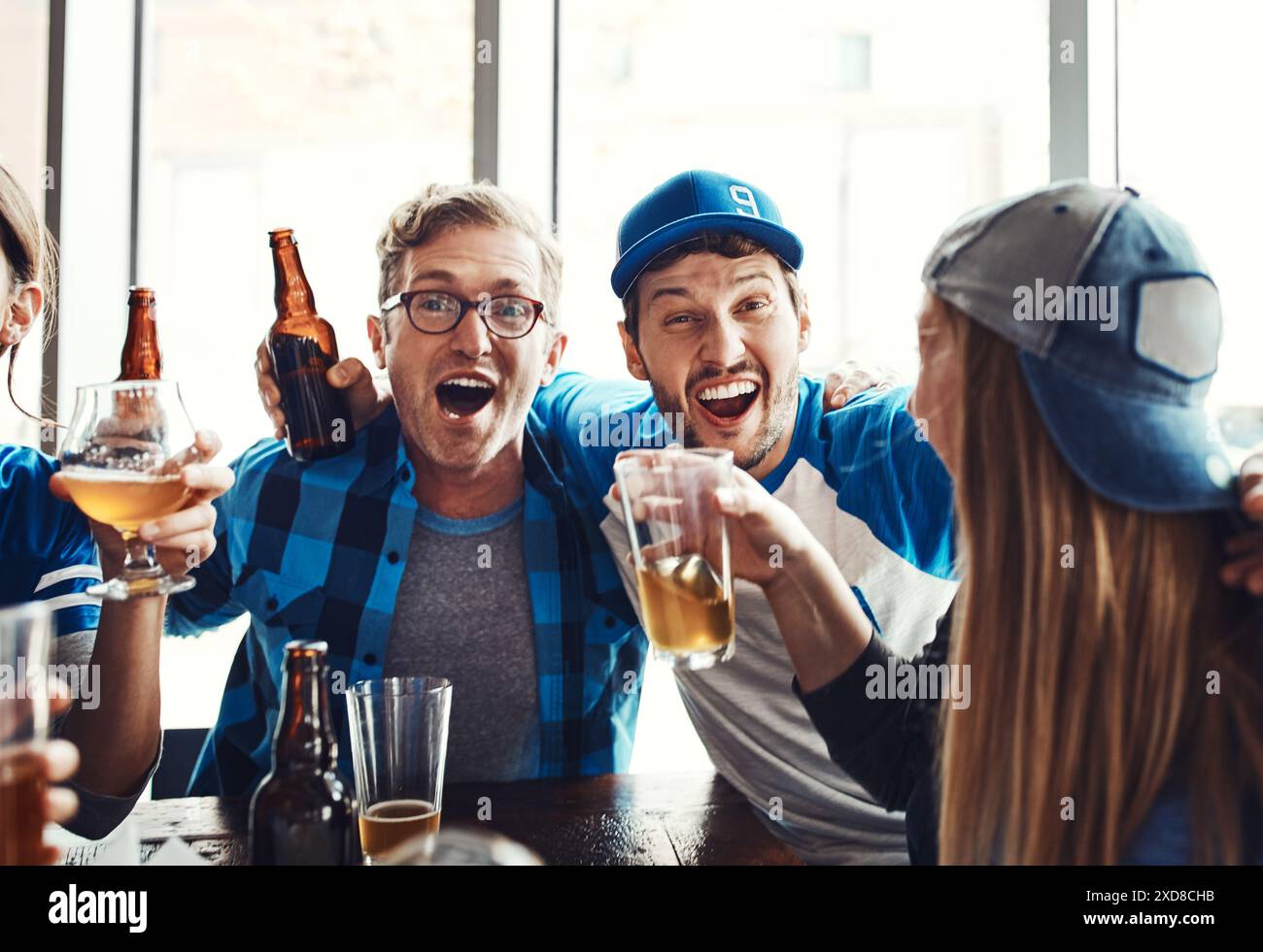 Sports, fans and excited with beer for celebration, support and people watching tv team game in ...