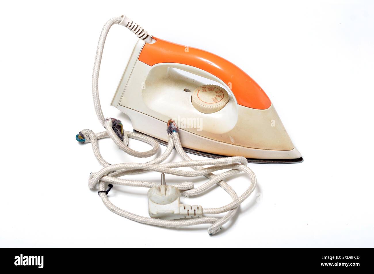 Electric iron with tangled cord white background Stock Photo - Alamy