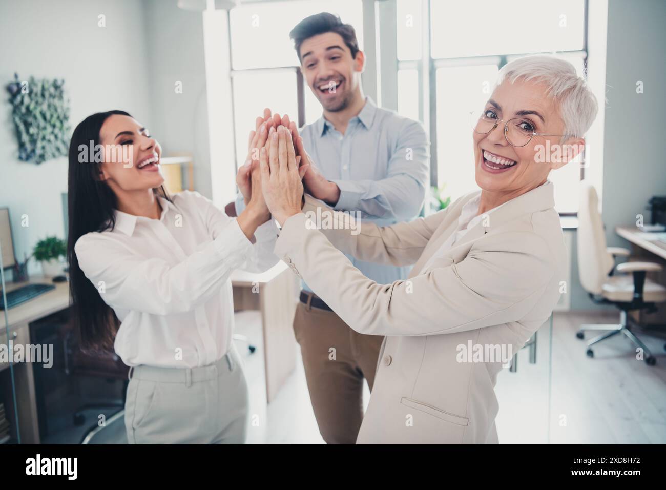 Photo of business people man women doing high five teambuilding concept ...