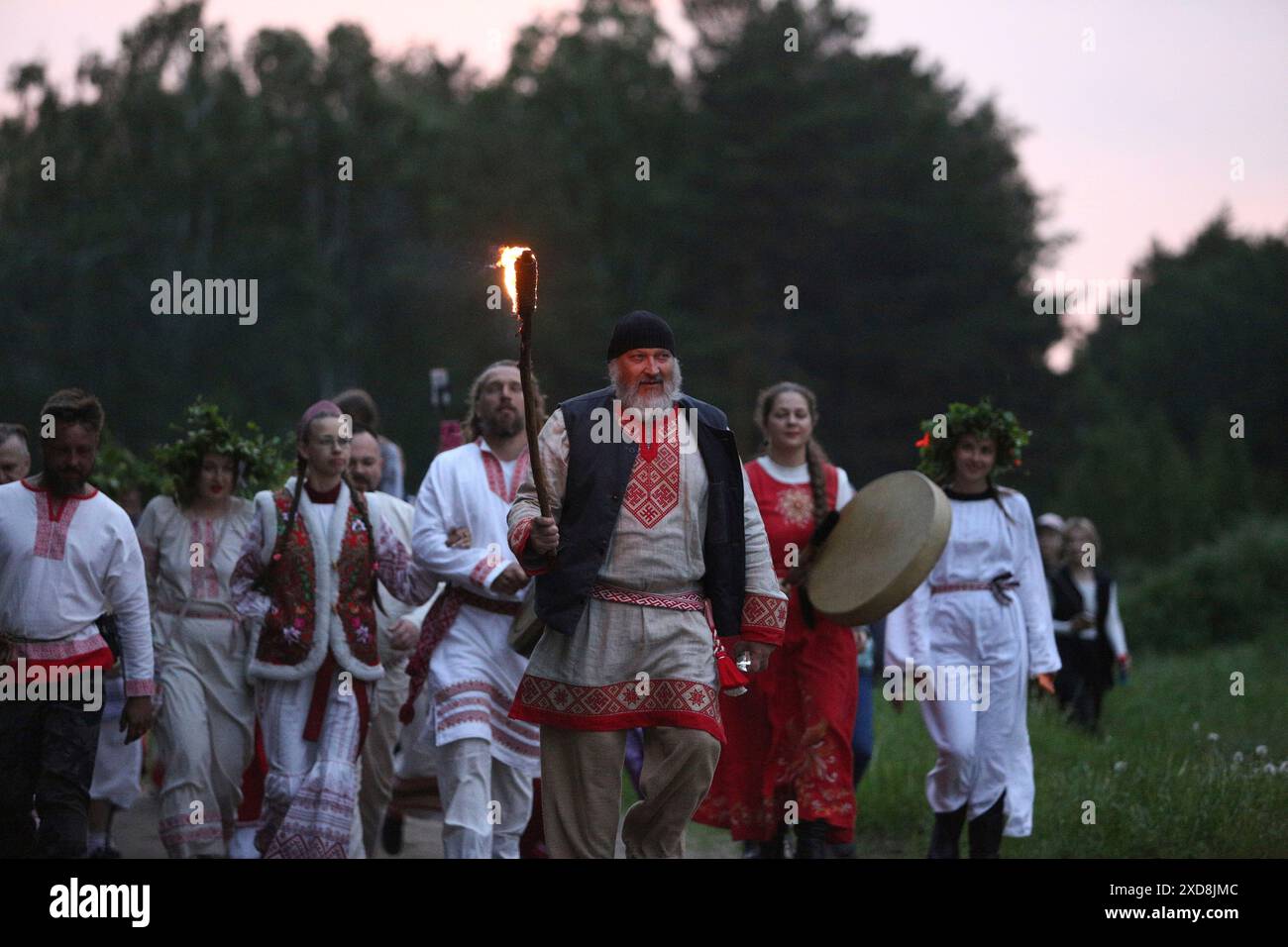 People wearing traditional Russian village-style clothes celebrate the ...