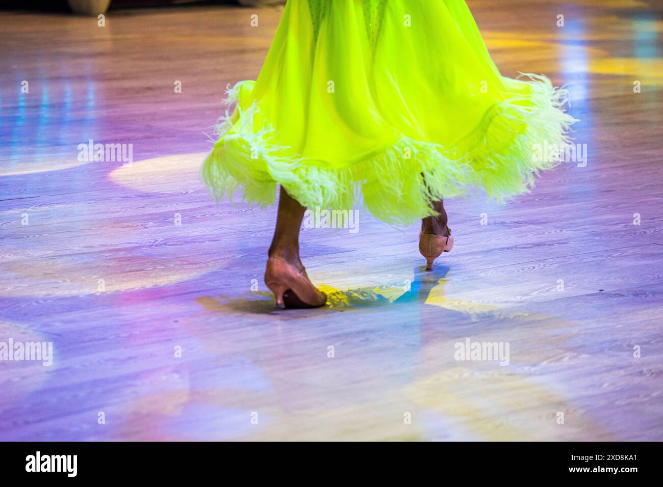 dance on high heels, dance in a lush crowd in multi-colored dresses ...