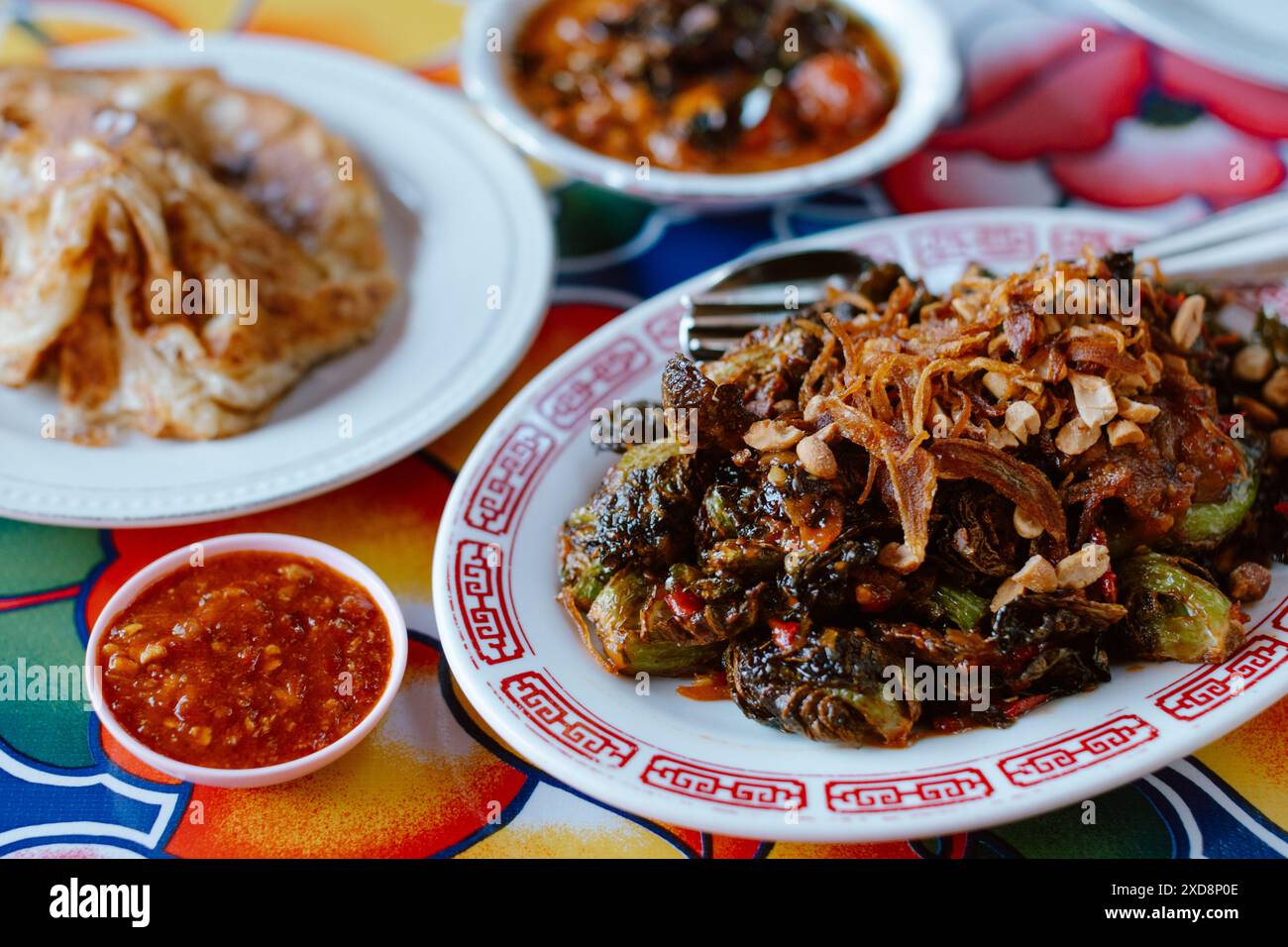 Indonesian cuisine with various dishes on a colorful table Stock Photo ...