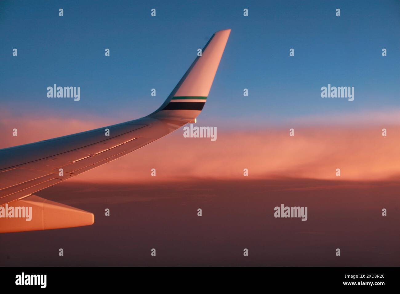 Airplane wing viewed against a sunset sky from hi-res stock photography ...