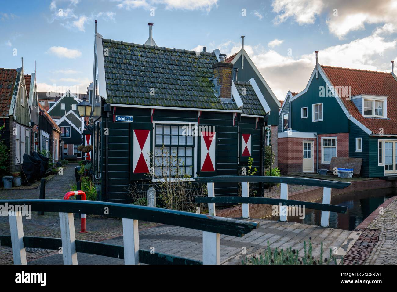 Volendam street with traditional dutch houses and a canal Stock Photo ...