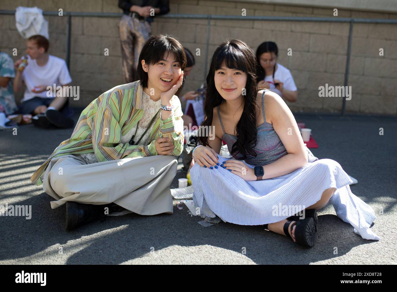 Angie, 21, and Ohana, 25, both Taylor Swift fans, pose for a photo as ...