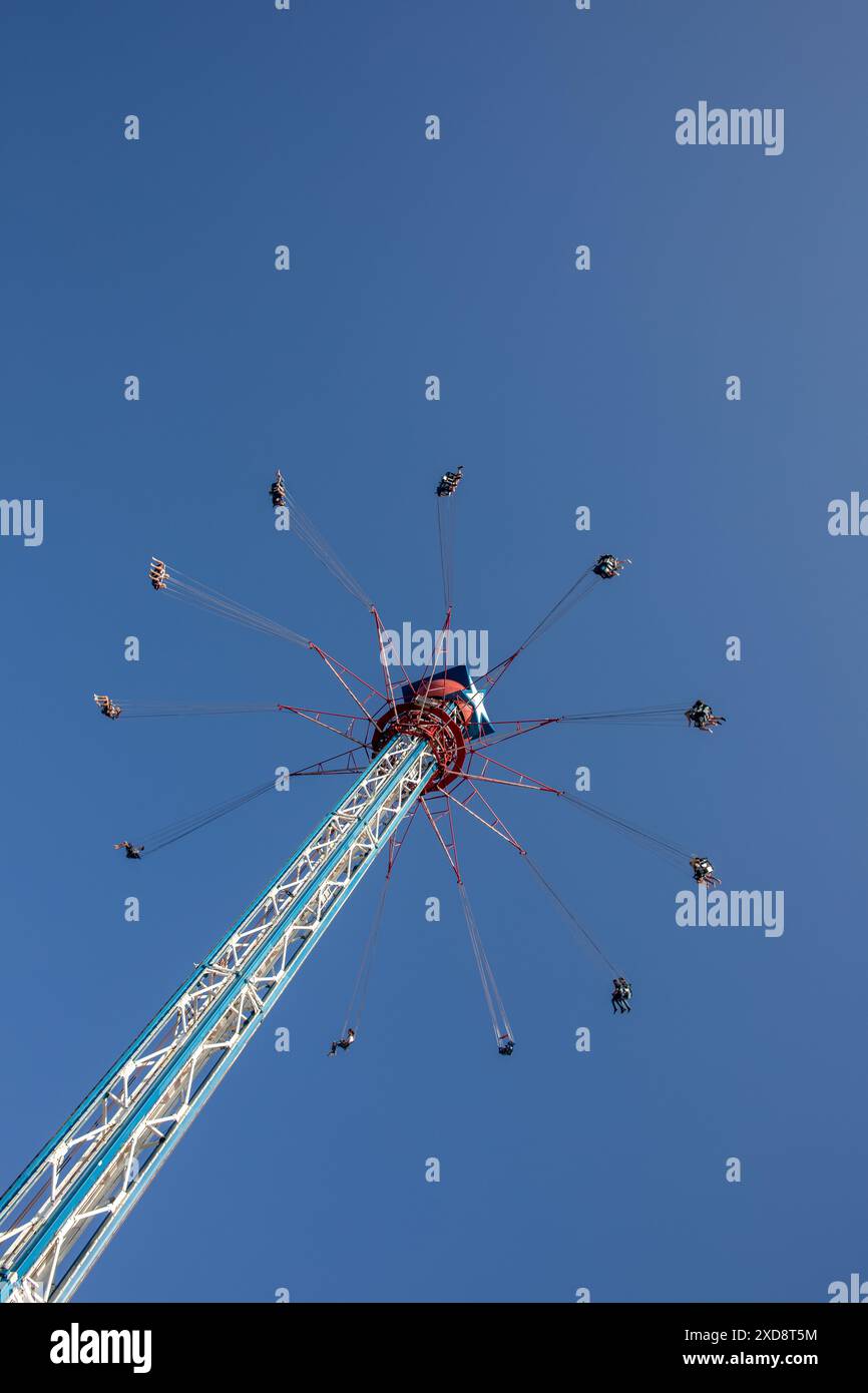 Family fun on high flying swing ride hi-res stock photography and ...