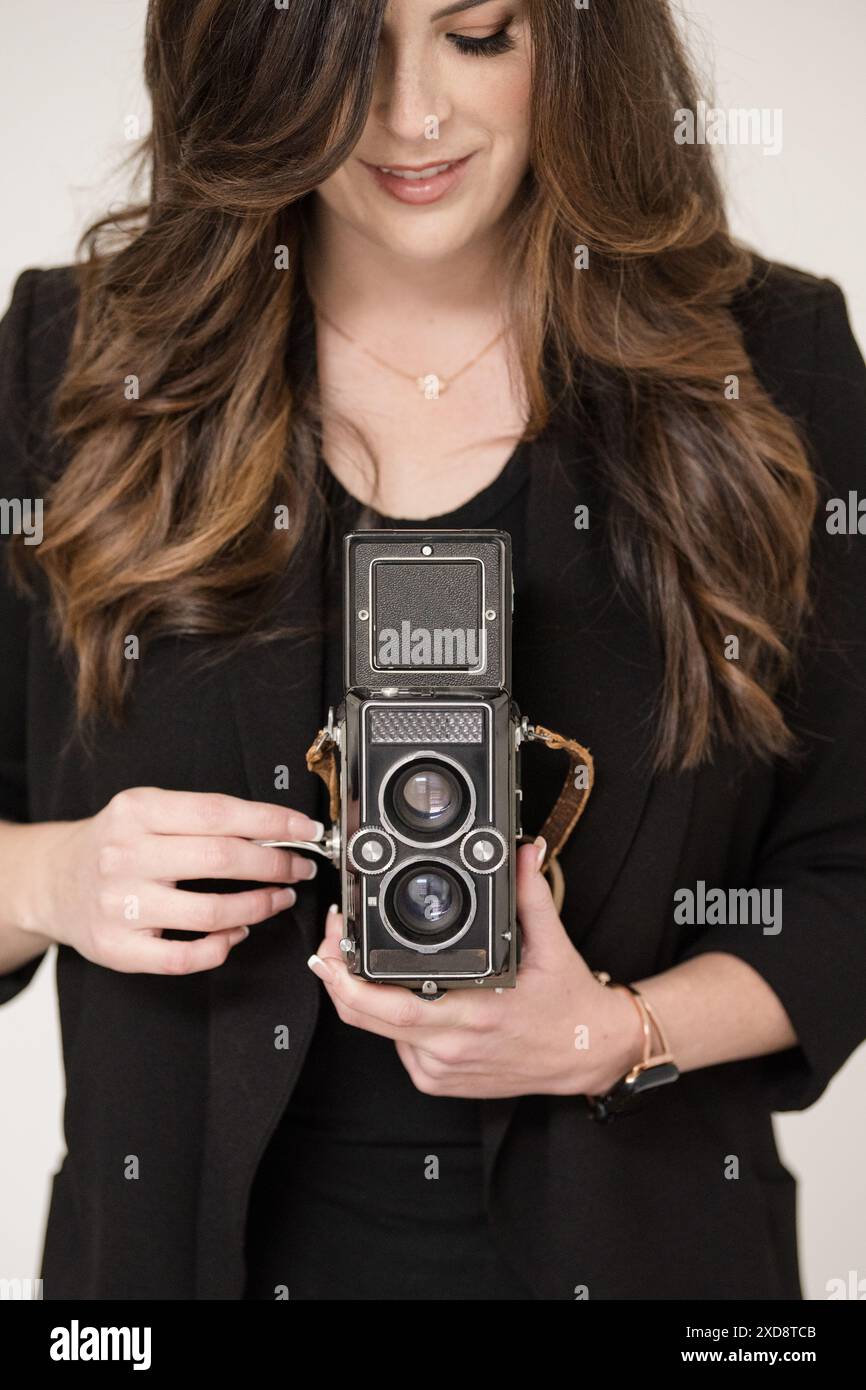 Women taking photo with old camera Stock Photo - Alamy