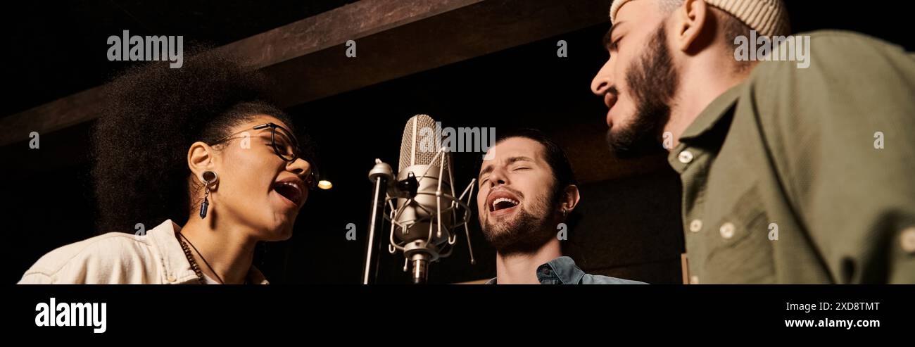 A diverse music band rehearsing together in a recording studio ...