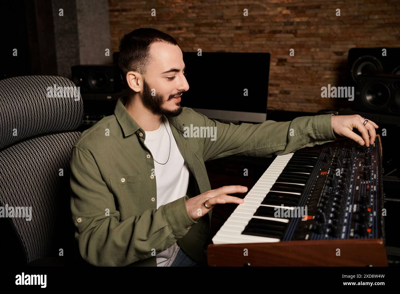 Talented man explores sonic possibilities on electronic keyboard during ...