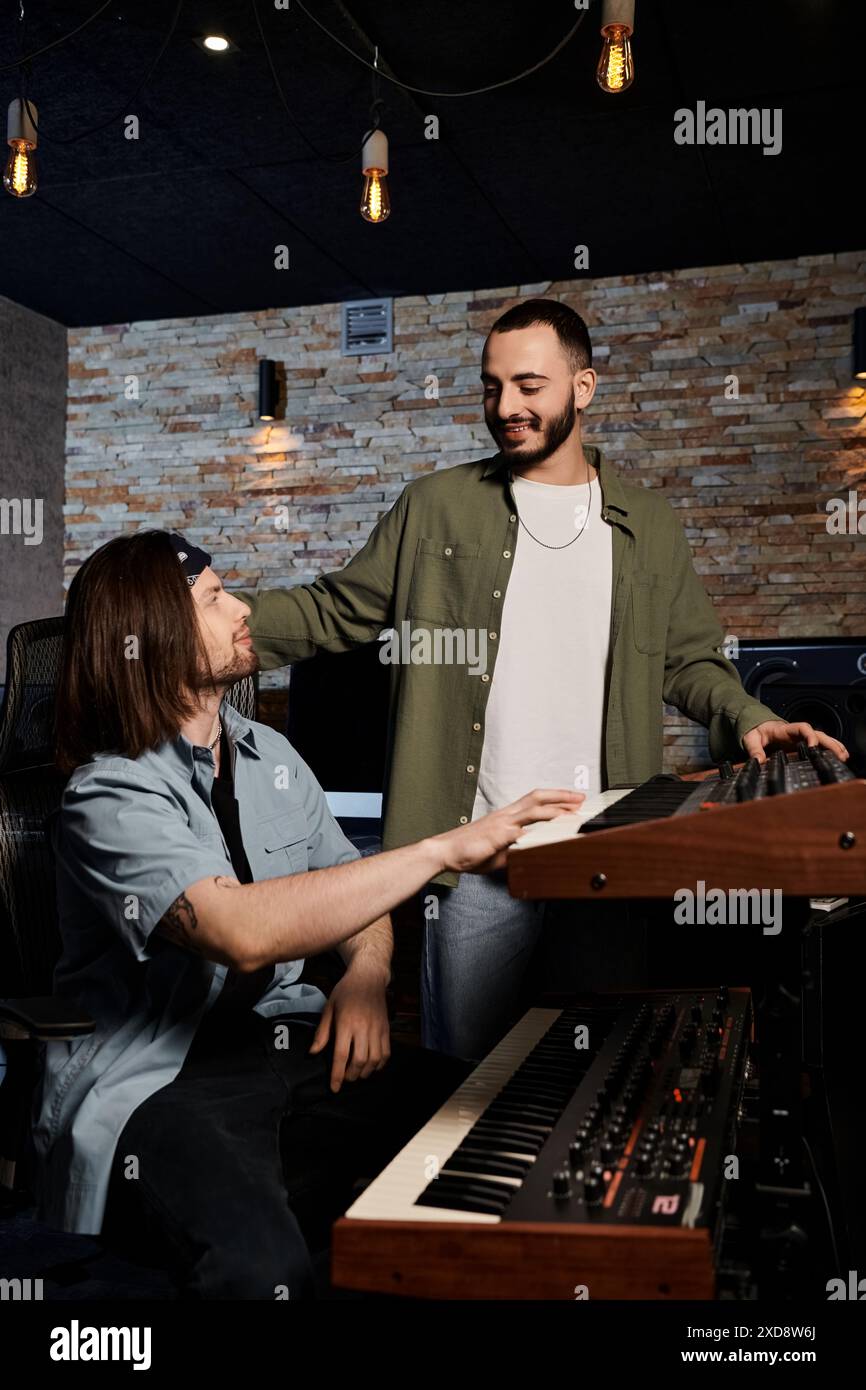 Two talented musicians stand in a recording studio, collaborating on ...