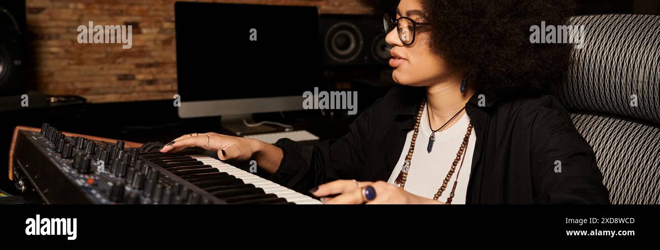 A woman with glasses passionately playing the keyboard in a recording ...
