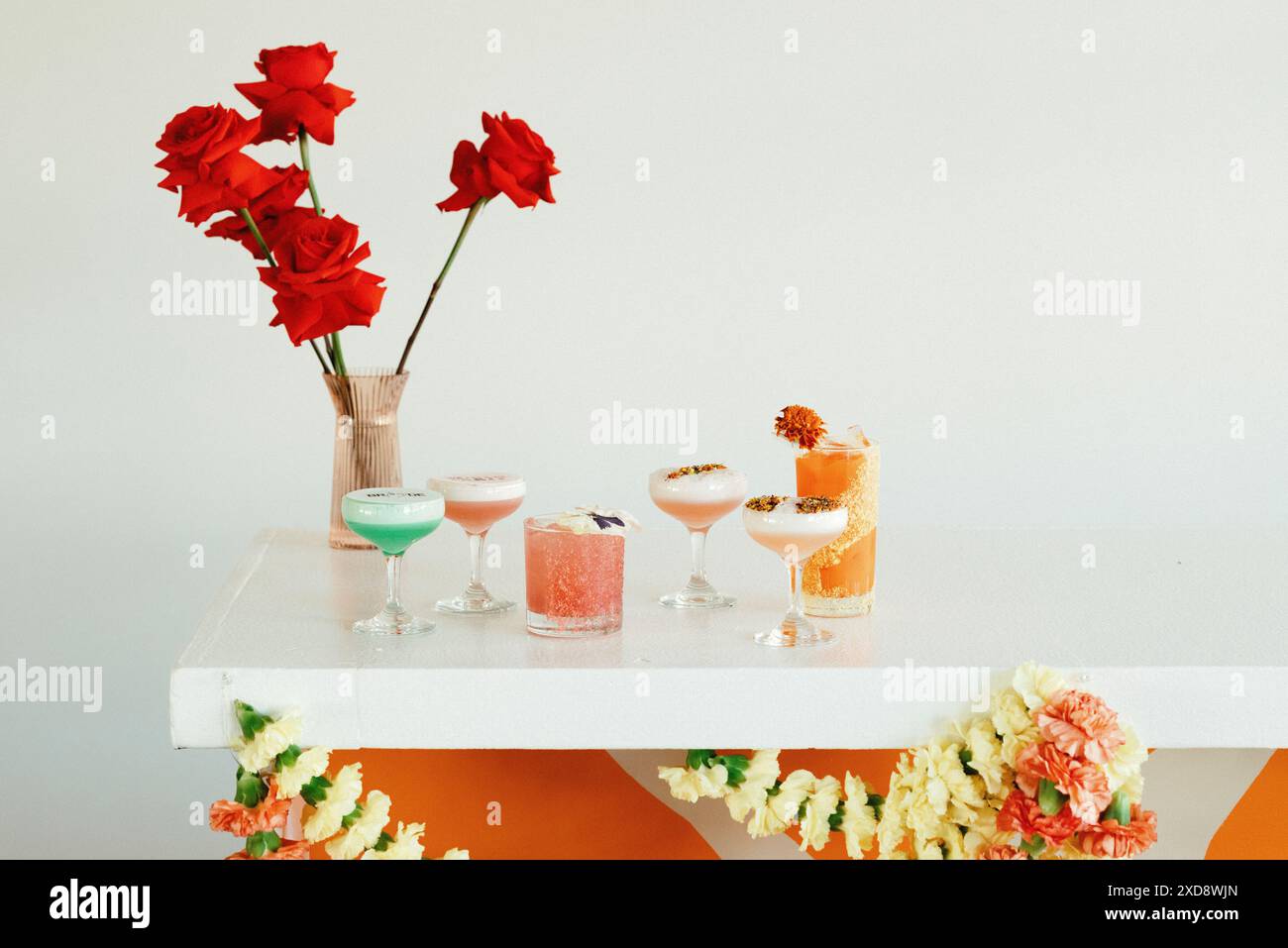 Colorful cocktails with red roses Stock Photo - Alamy