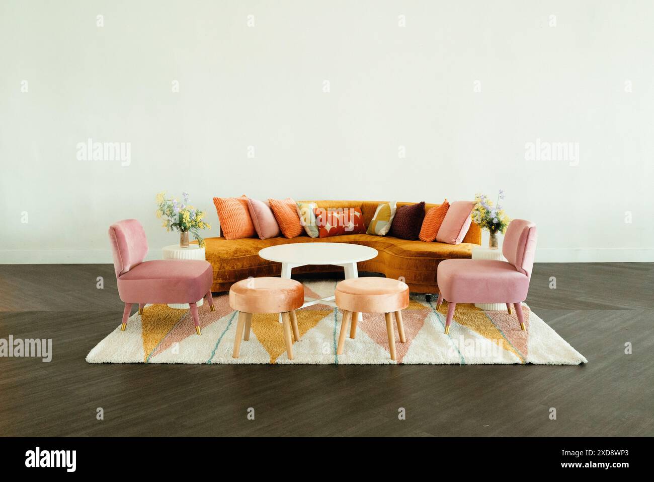 Modern living room setup with colorful furniture Stock Photo - Alamy