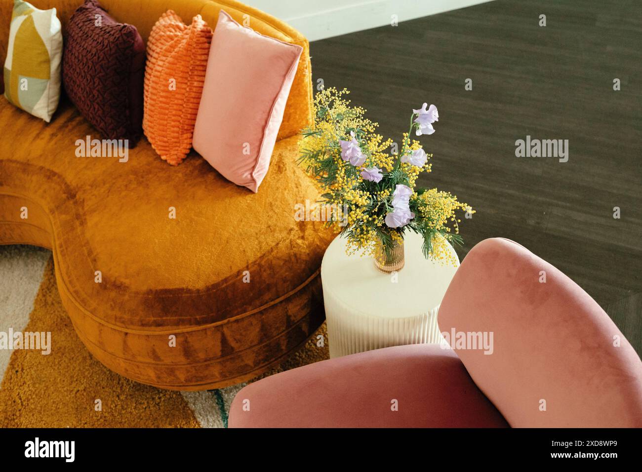 Cozy seating area with colorful pillows Stock Photo - Alamy