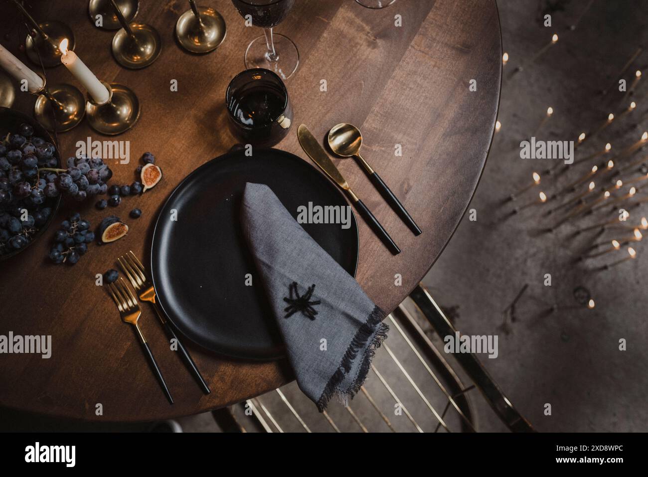 Elegant halloween dinner table setting w/ spider Stock Photo - Alamy