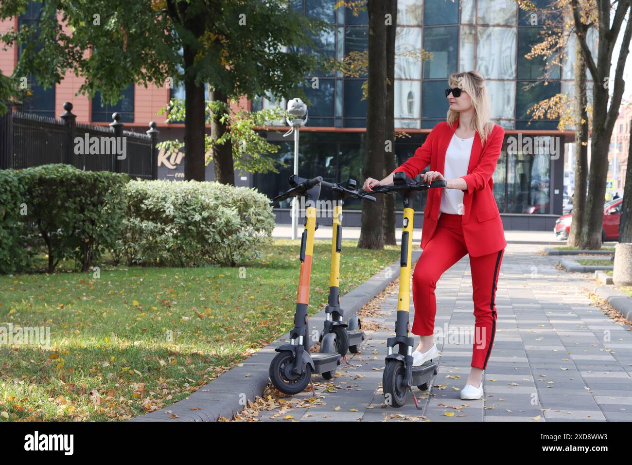 Cheerful woman on scooter hi-res stock photography and images - Alamy