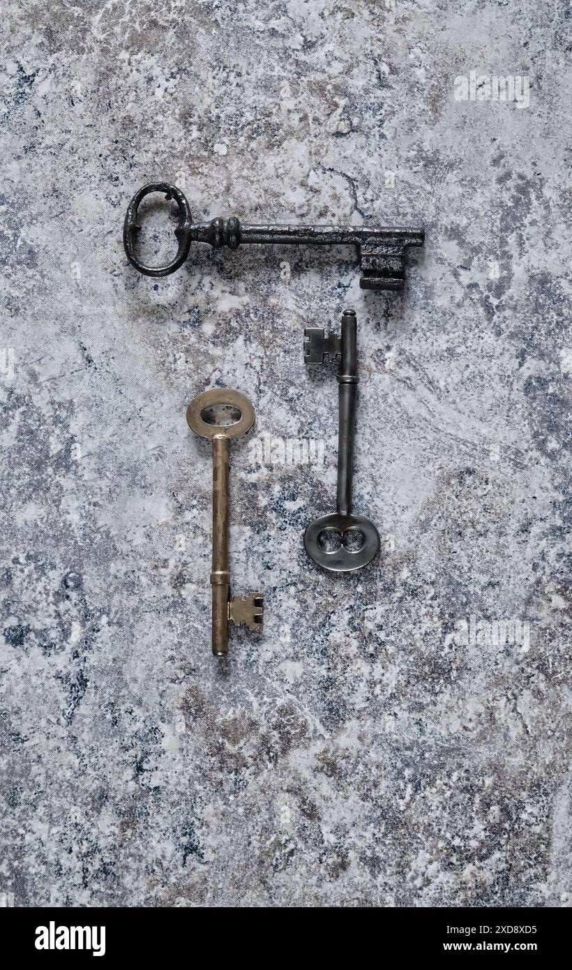 3 old large keys arranged in a pattern viewed from above, book cover ...