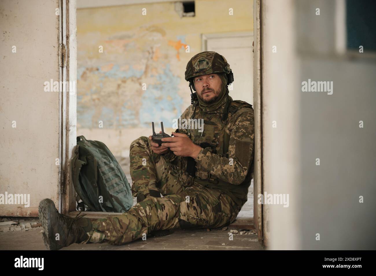 Military mission. Soldier in uniform with drone controller inside ...