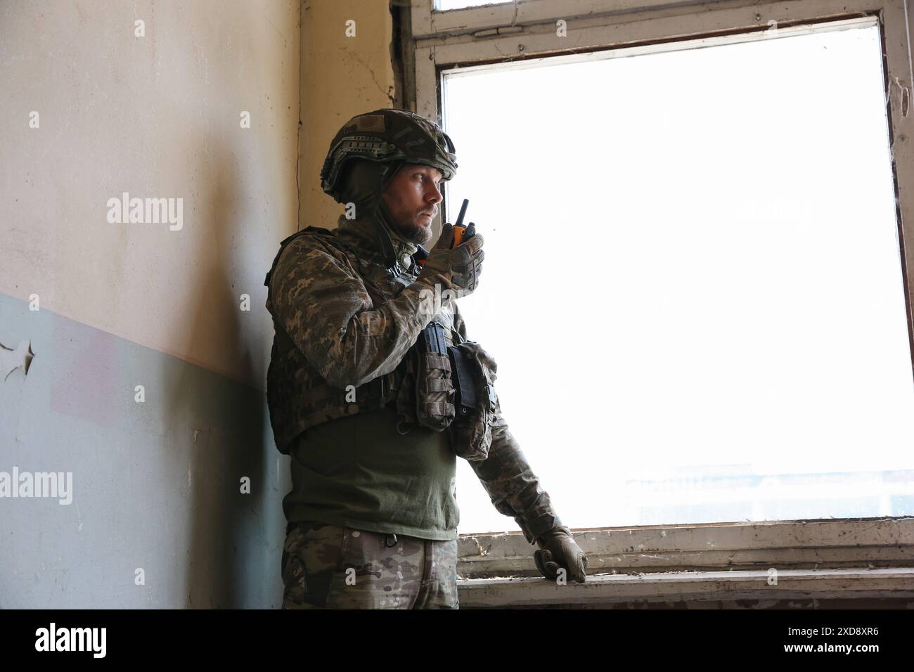 Military mission. Soldier in uniform with radio transmitter inside ...