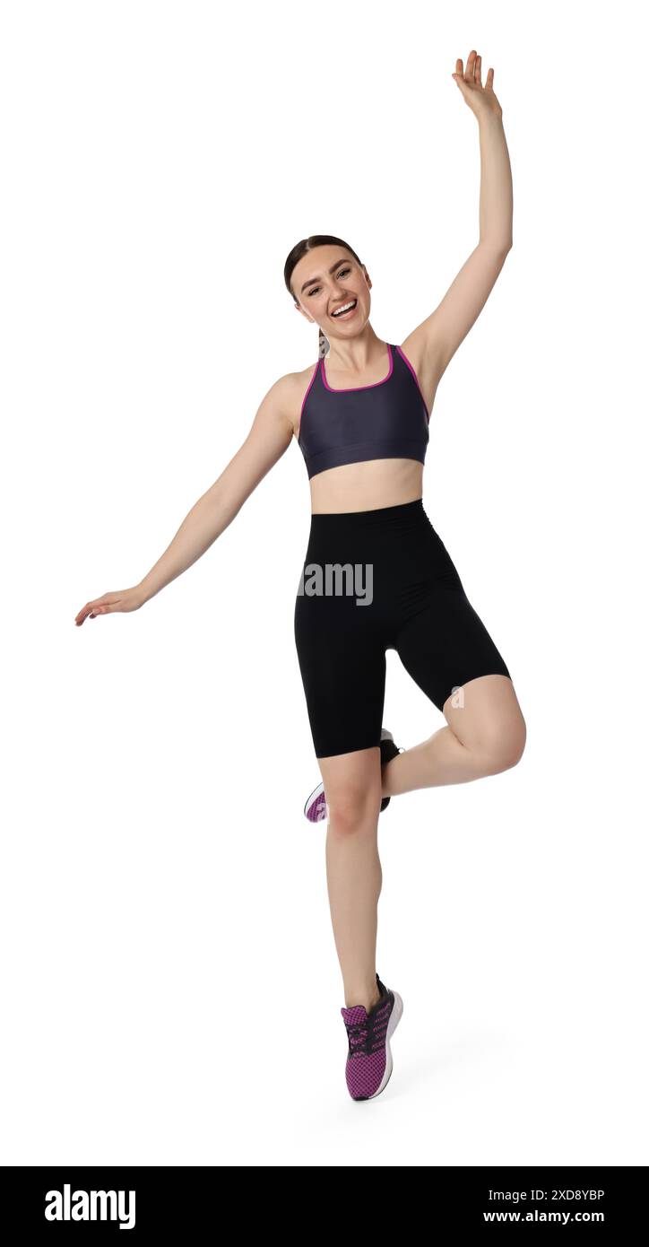 Young woman doing aerobic exercise on white background Stock Photo - Alamy