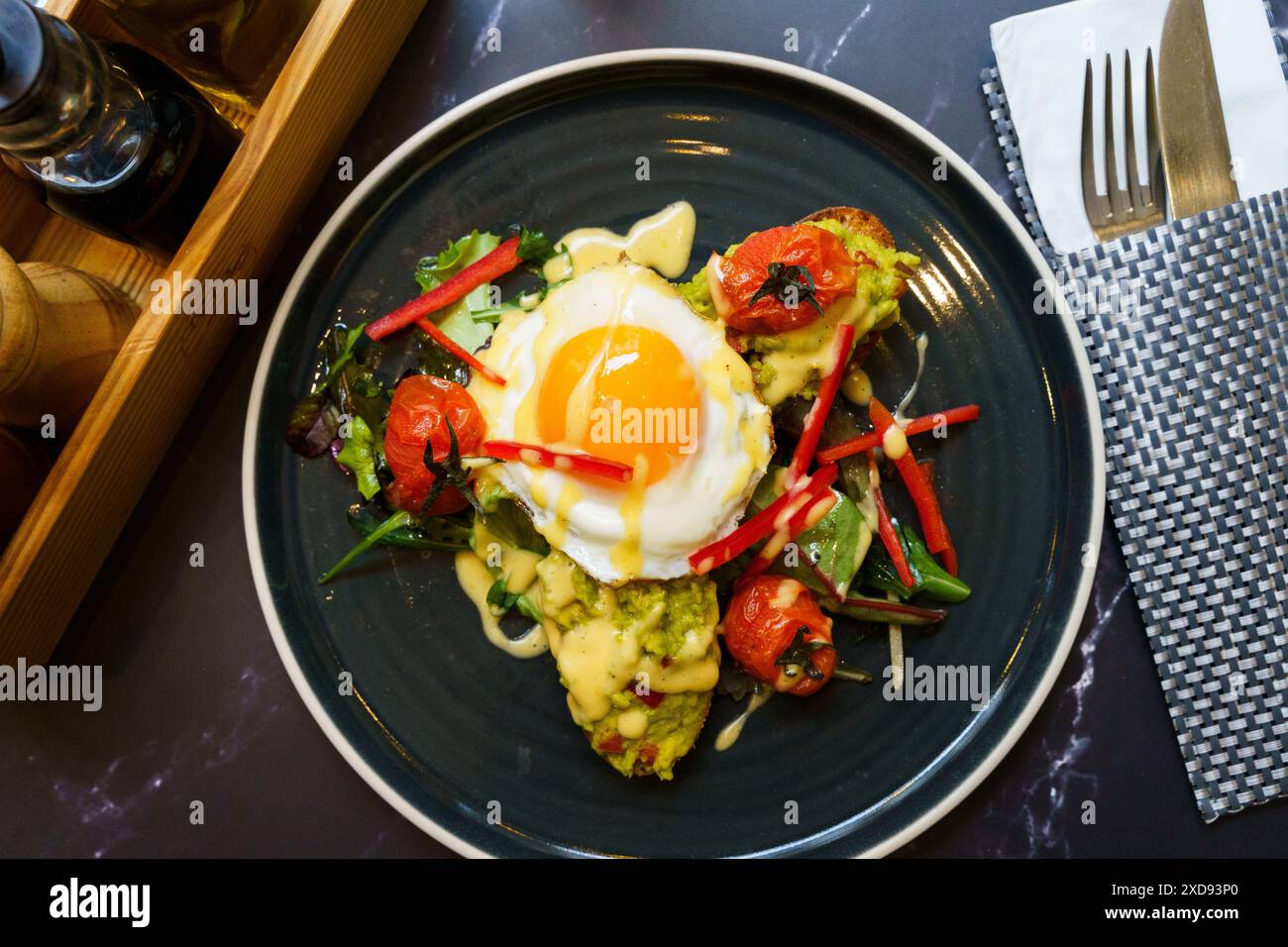 Top down of Avocado toast with fried eggs and vegetables Stock Photo ...