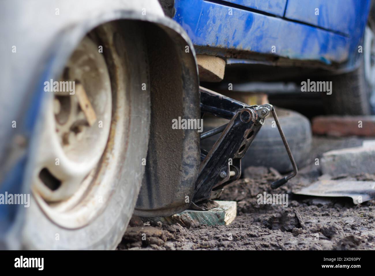Old car jack. Hydraulic jack repair. Mechanic changing tire. Vintage ...