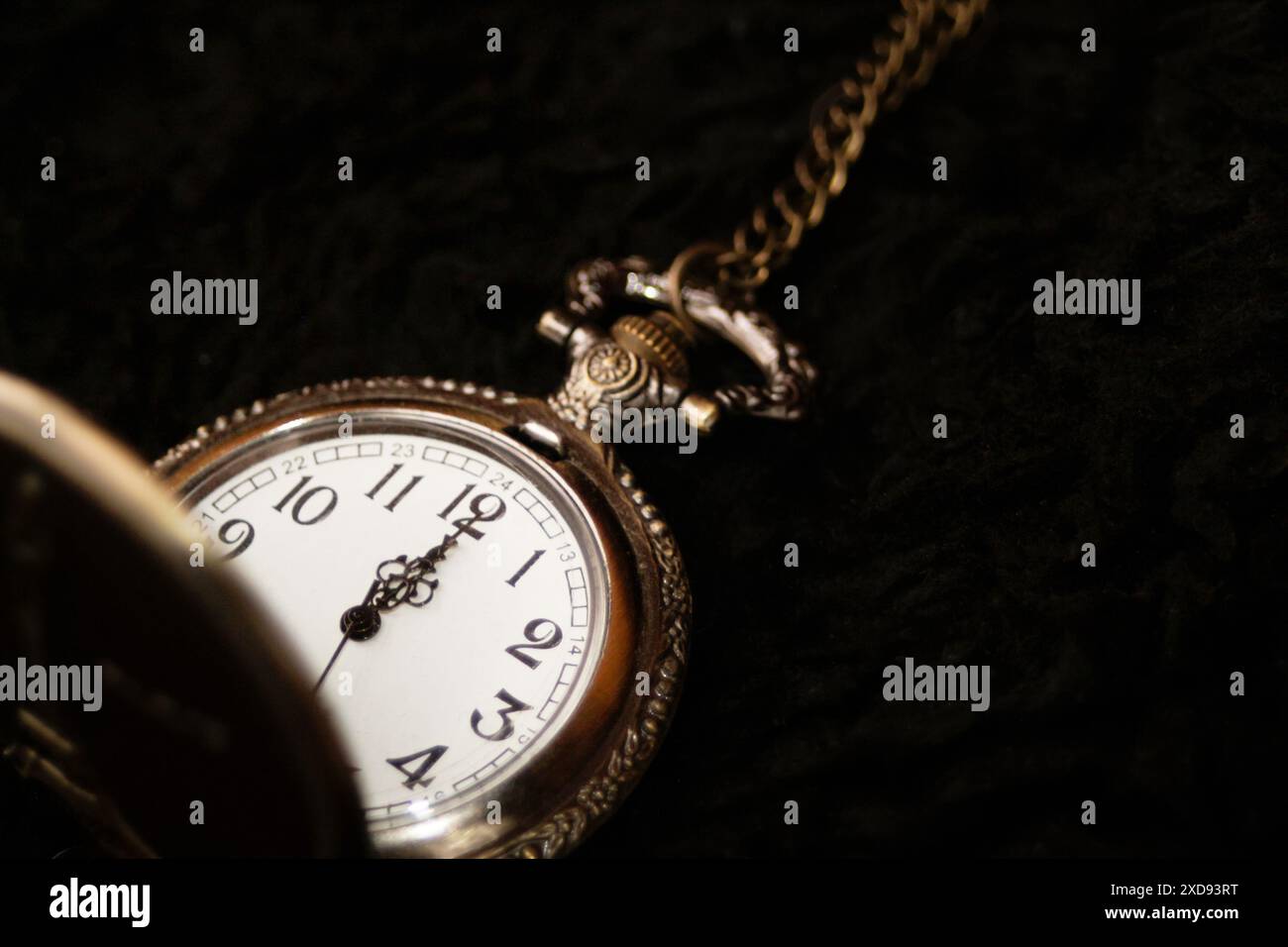 Retro clock on black background. Vintage watch showing twelve. Close up ...