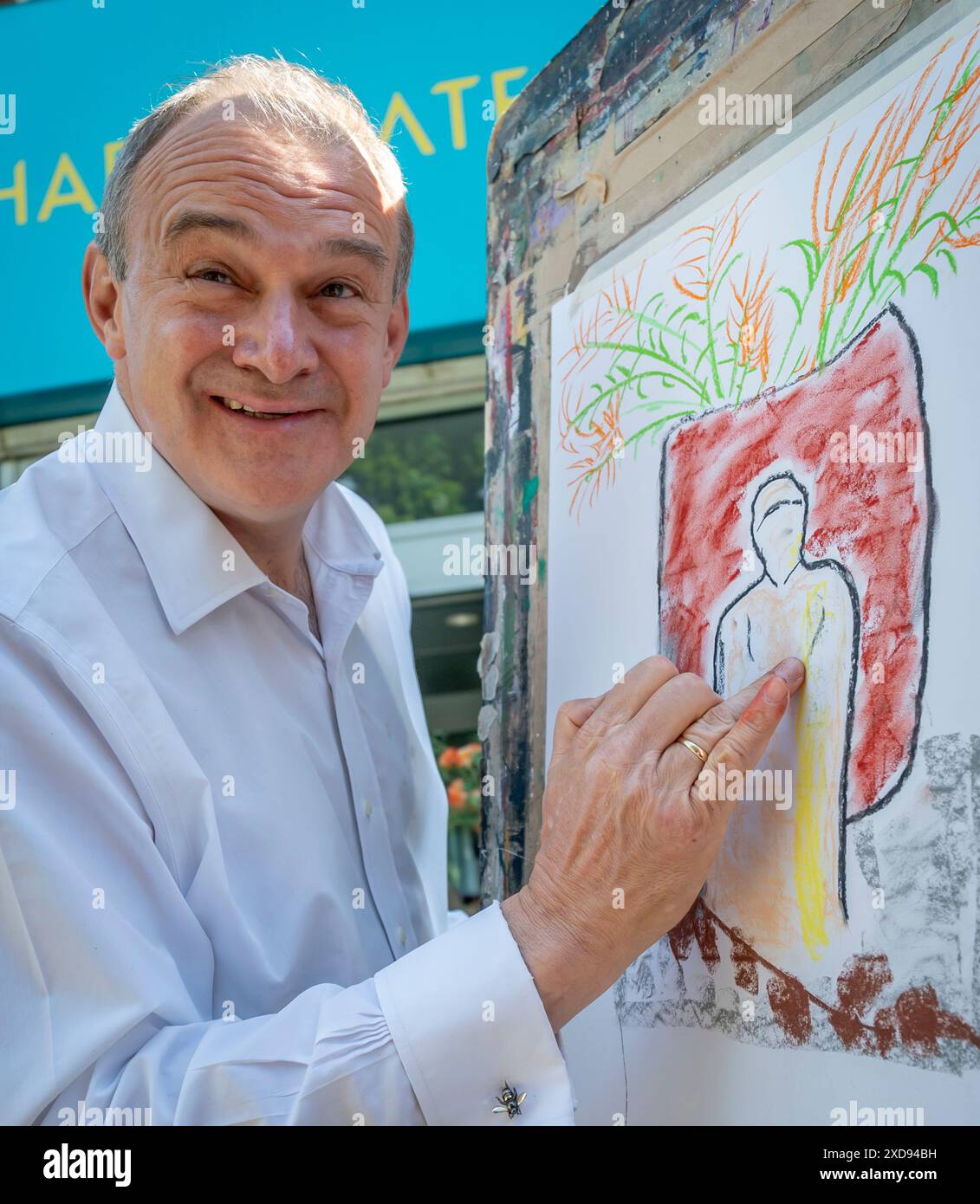 Liberal Democrats leader Sir Ed Davey drawing a charcoal on pastel ...