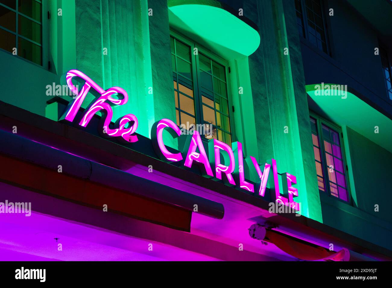 Neon sign on the facade of art deco Carlyle Hotel along Ocean Drive at ...