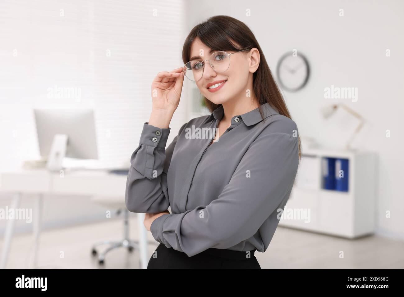 Smiling corporate lady wearing hi-res stock photography and images - Alamy